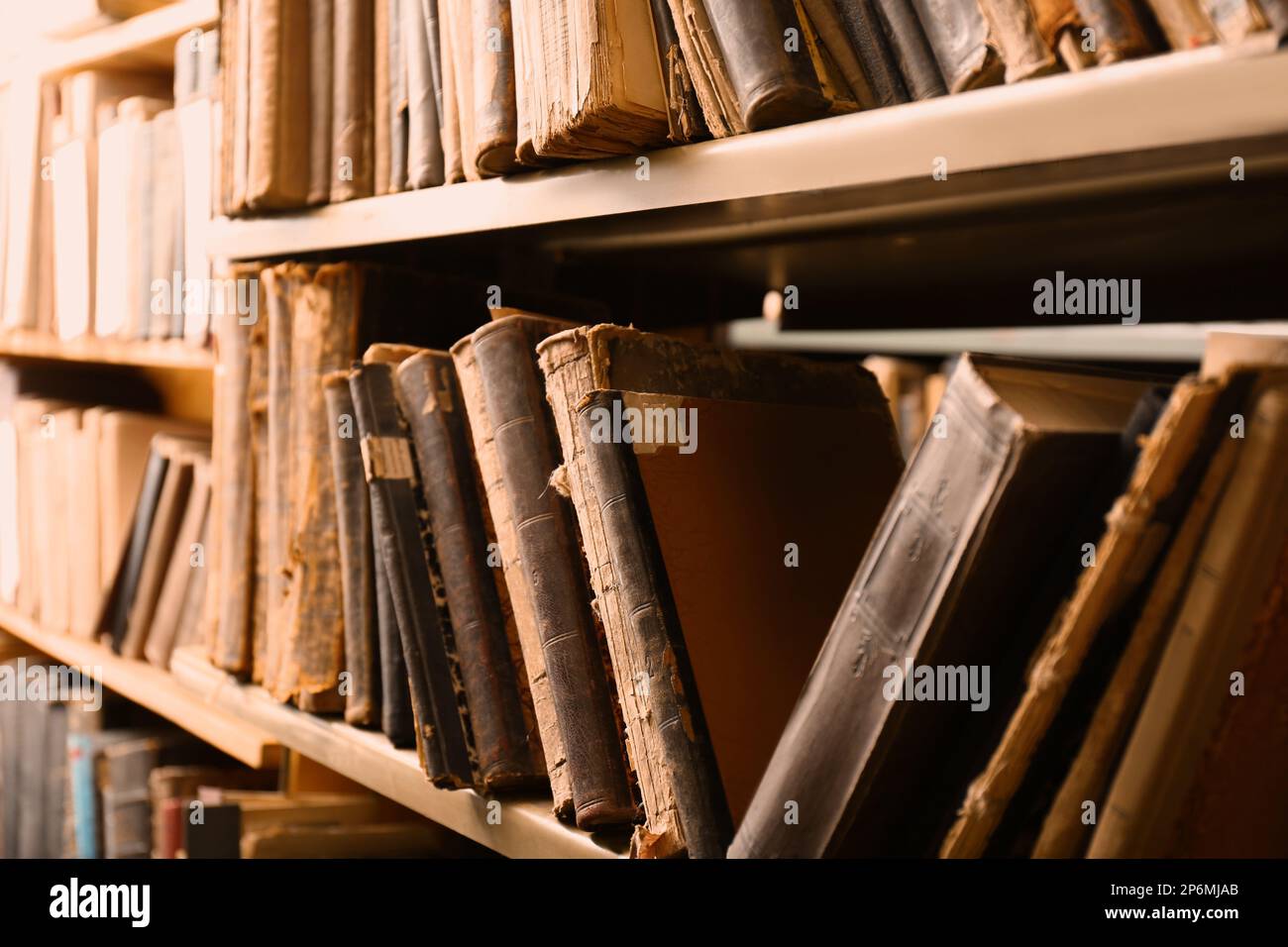 Collection of old books on shelves in library Stock Photo - Alamy