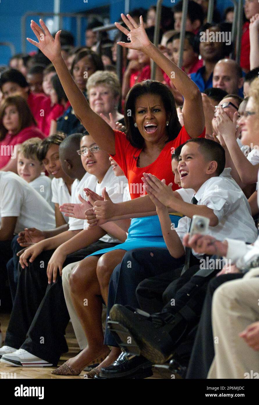 First lady Michelle Obama cheers with students from Nancy Moseley ...