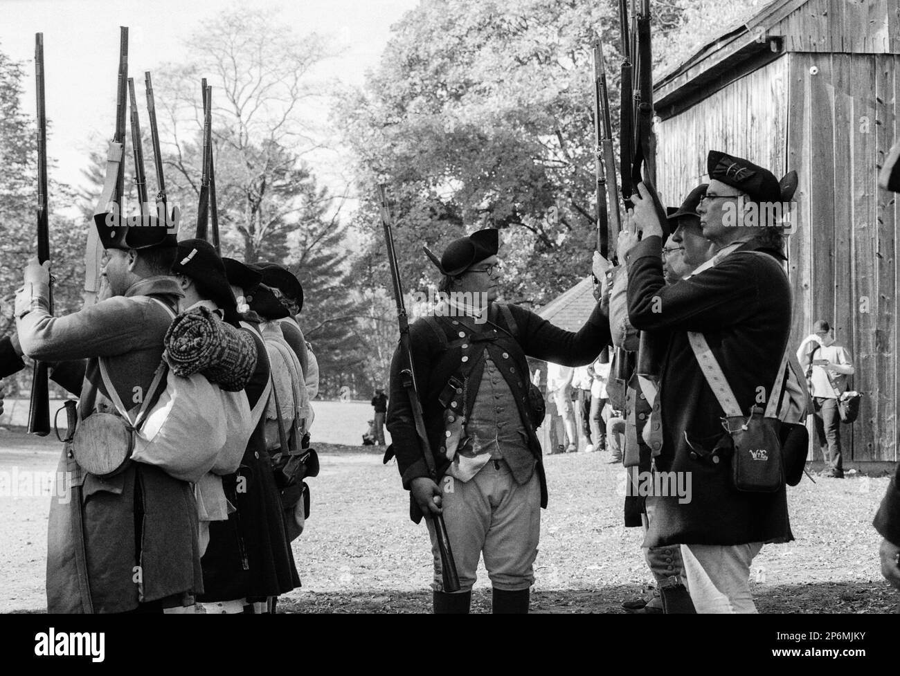 Actors/soldiers in colonial uniforms stand at attention for inspection ...