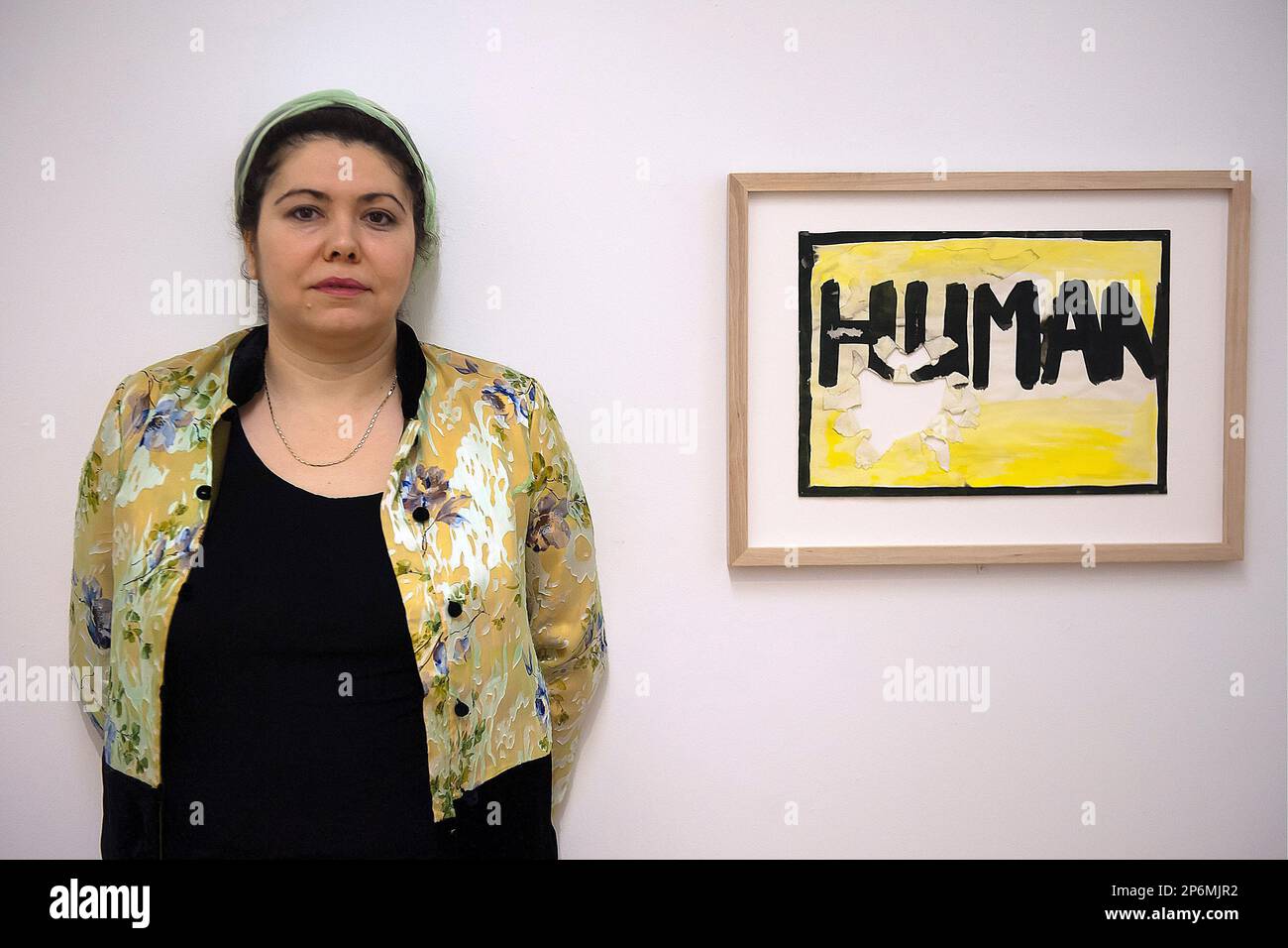Hungarian artist Roza El-Hassan poses next to her artwork 'R. Thinking/Dreaming about ...