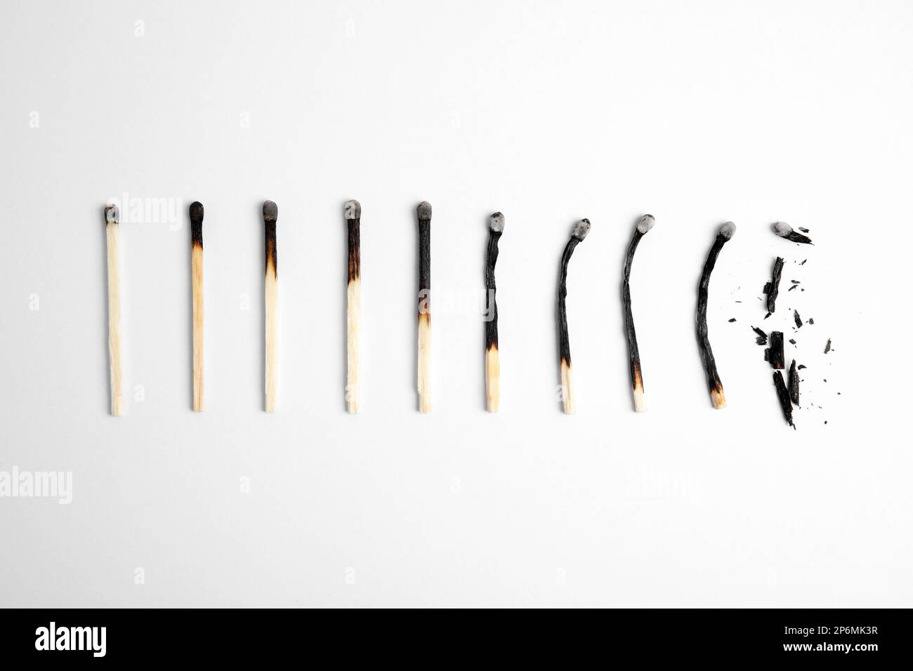 Different stages of burnt matches on white background, flat lay Stock ...