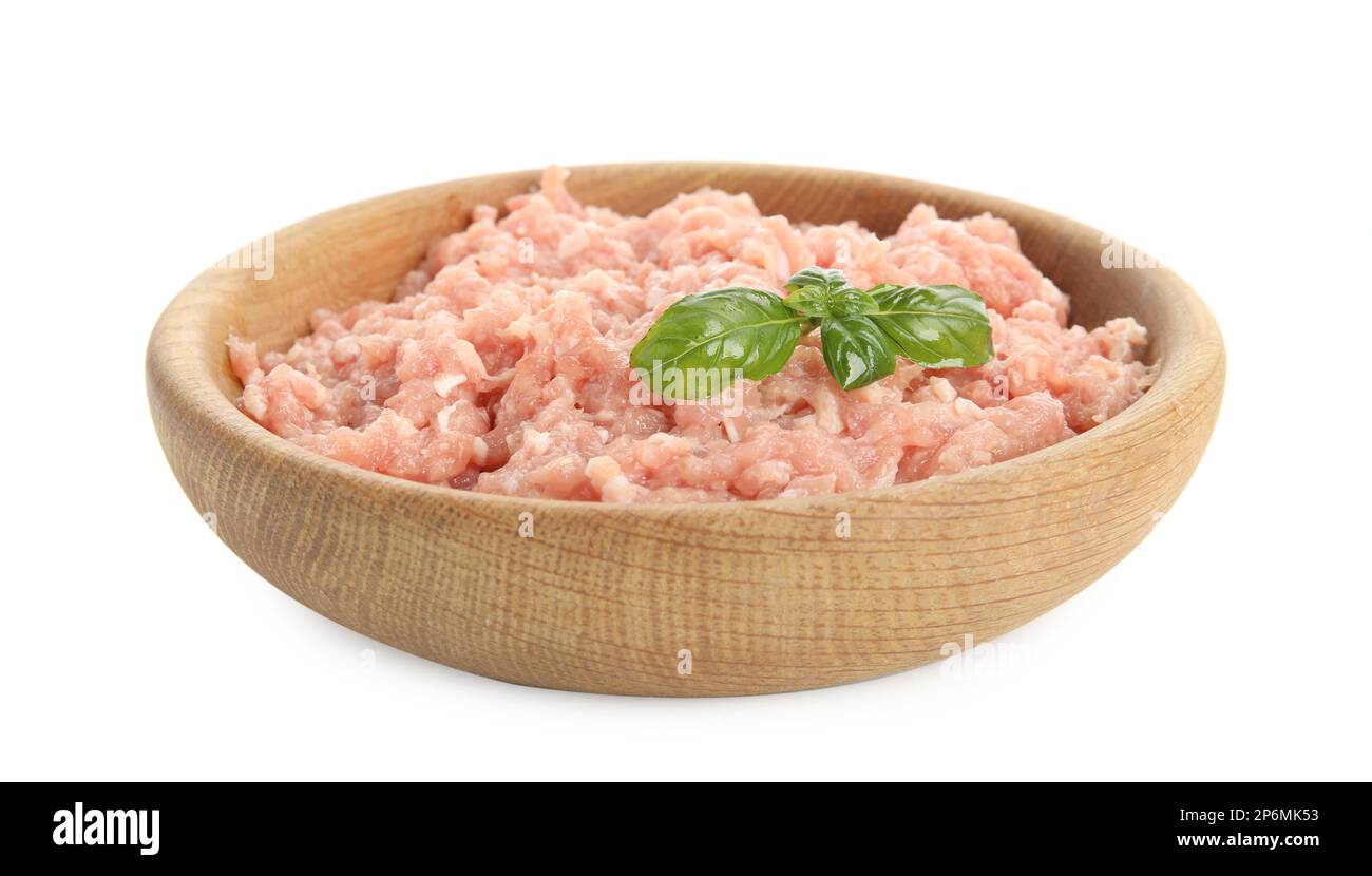 Raw chicken minced meat with basil in bowl on white background Stock ...