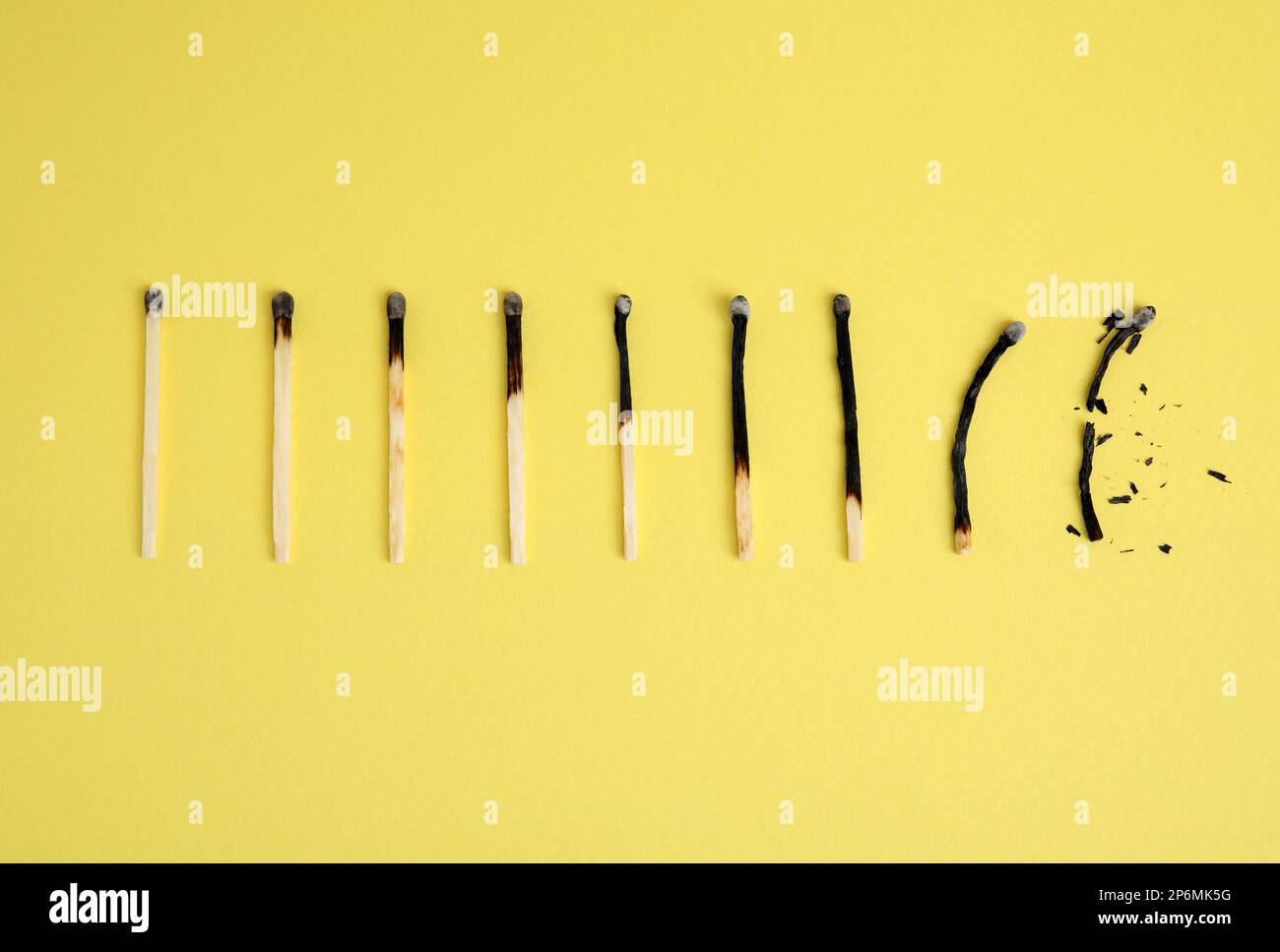 Different stages of burnt matches on yellow background, flat lay Stock ...