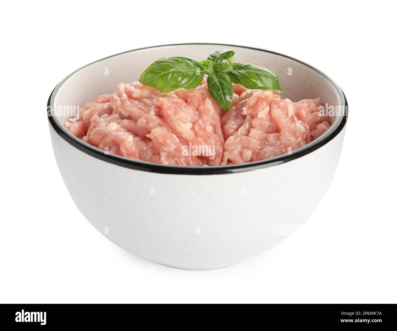 Raw chicken minced meat with basil in bowl on white background Stock ...