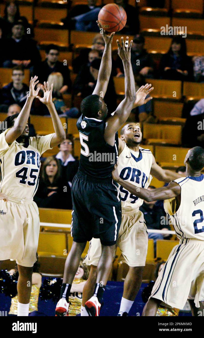 IUPUI's Alex Young (5) shoots over Oral Roberts' Dominique Morrison (45 ...
