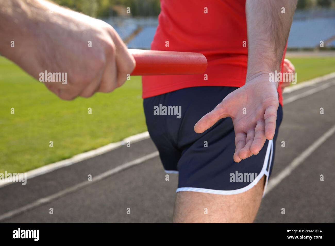 Passing the baton business hi-res stock photography and images - Alamy