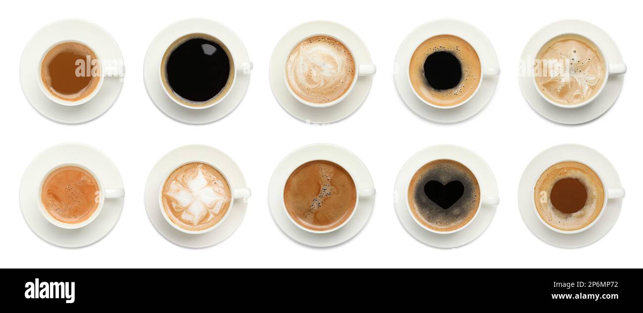Set with cups of tasty aromatic coffee on white background, top view ...