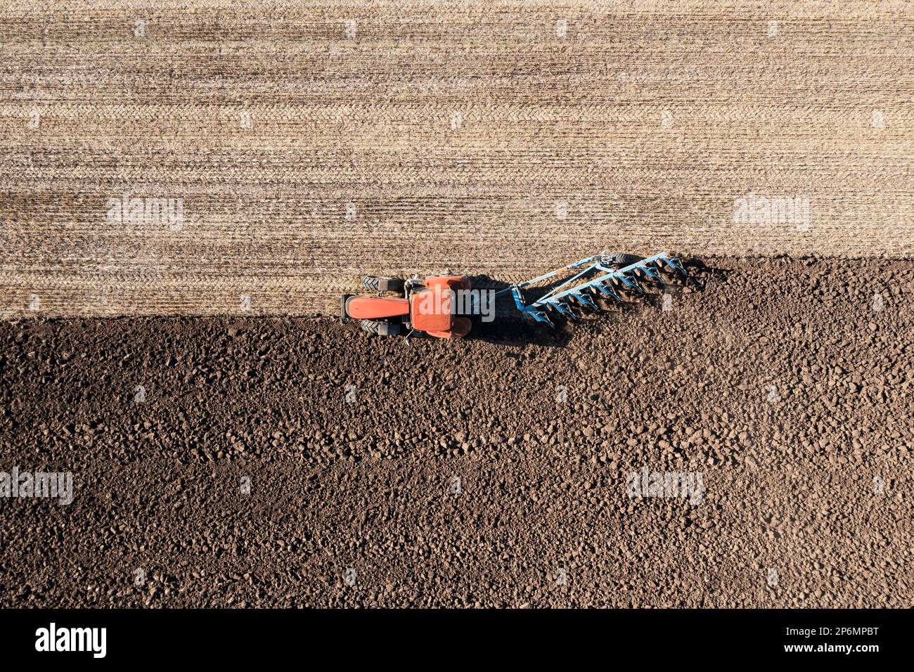 Aerial view farm tractor pulling hi-res stock photography and images ...