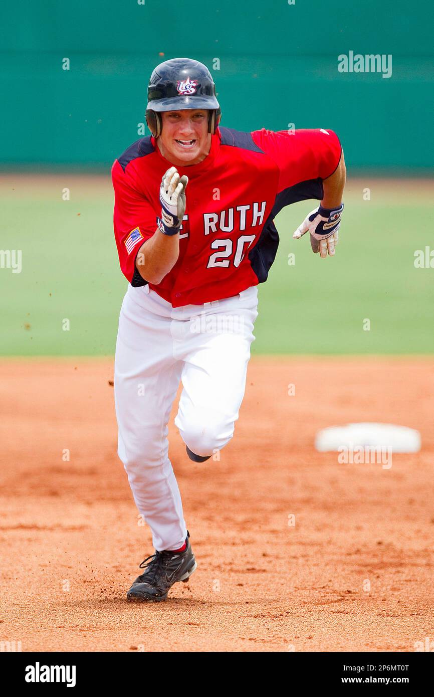 Ty Moore #20 of Babe Ruth hustles towards third base against PONY at ...