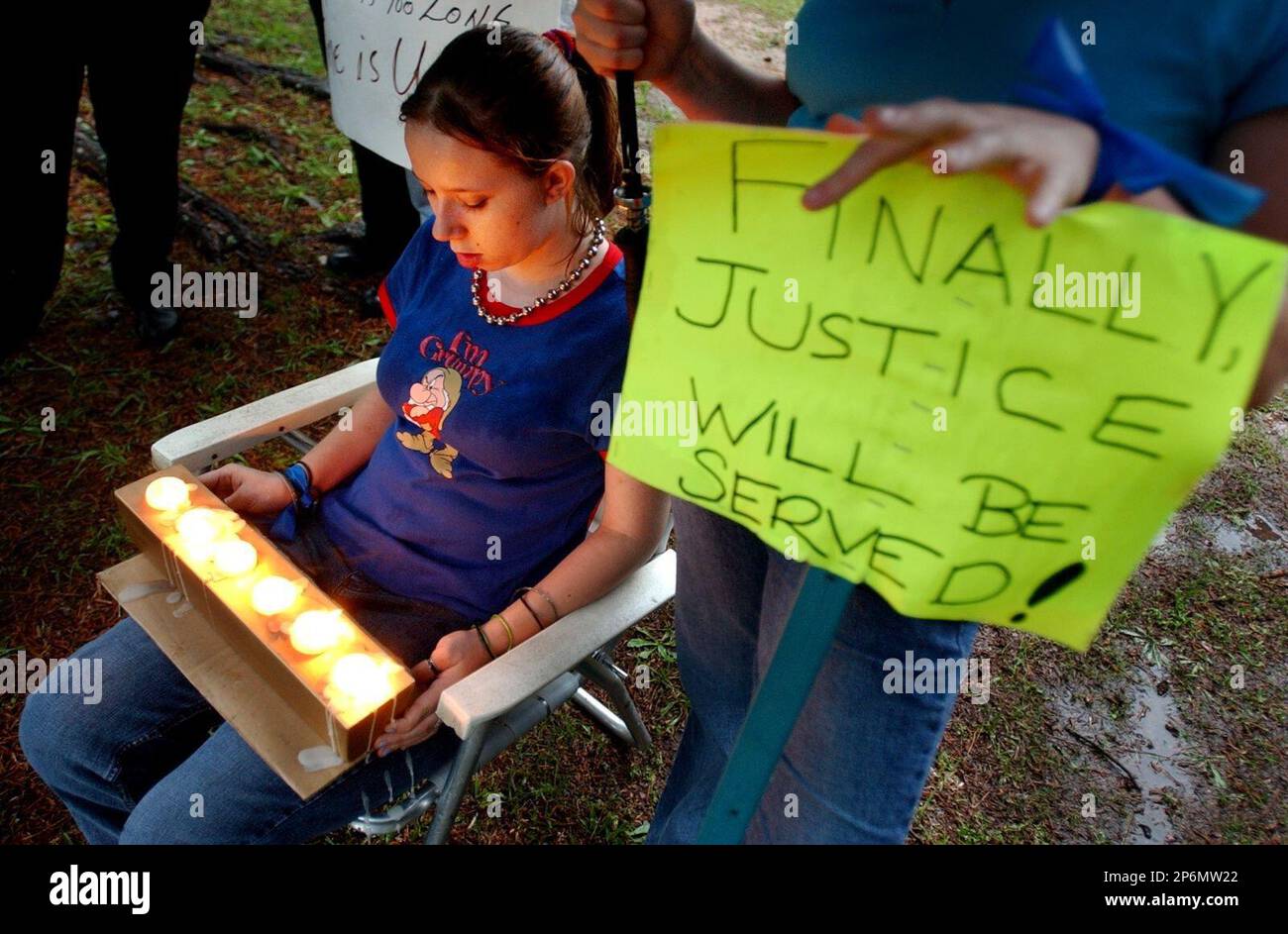 Christina Martin, Milner, holds six candles in honor of the six ...