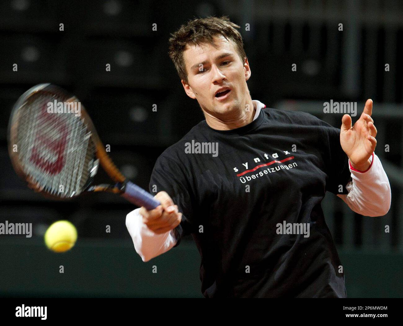 Switzerland's Davis Cup tennis player Marco Chiudinelli plays a ball ...