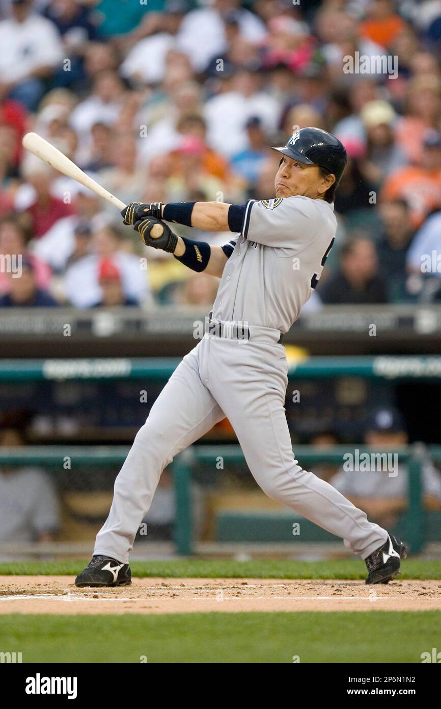 Hideki Matsui #55 of the New York Yankees follows through on his swing ...
