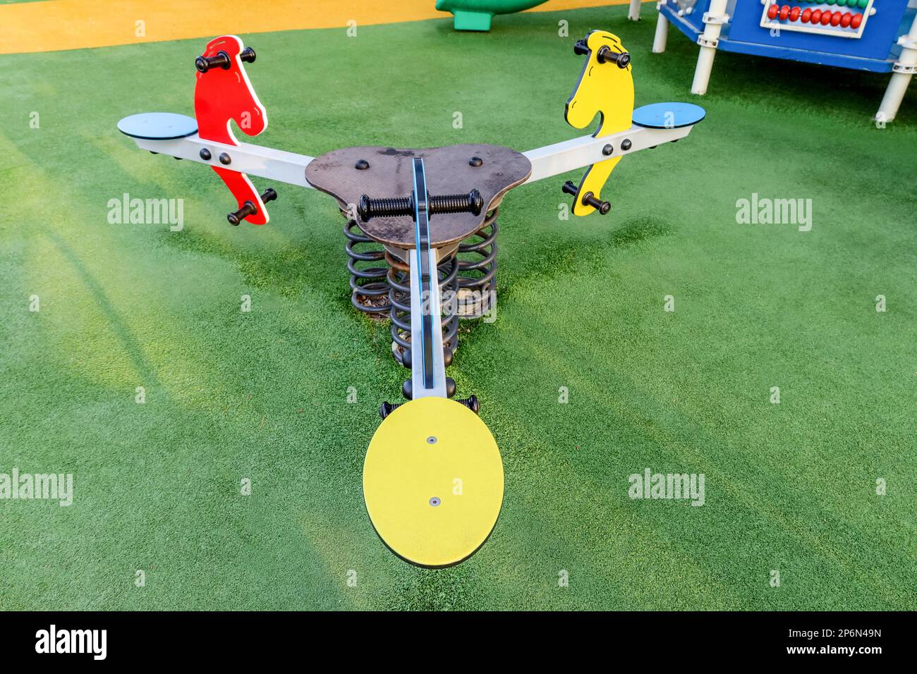 Spring rocker on children's playground Stock Photo - Alamy