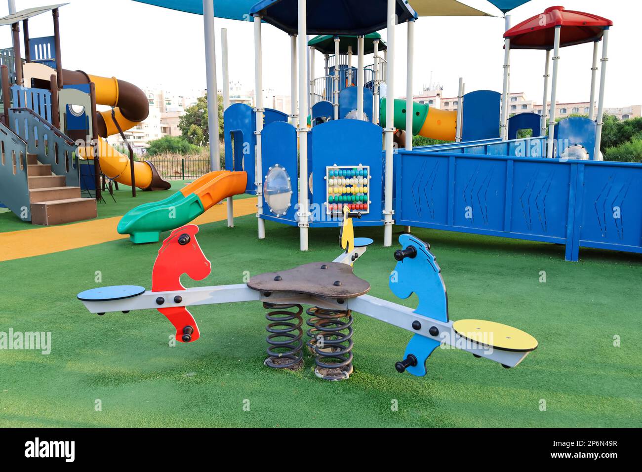 Spring rocker on children's playground Stock Photo - Alamy