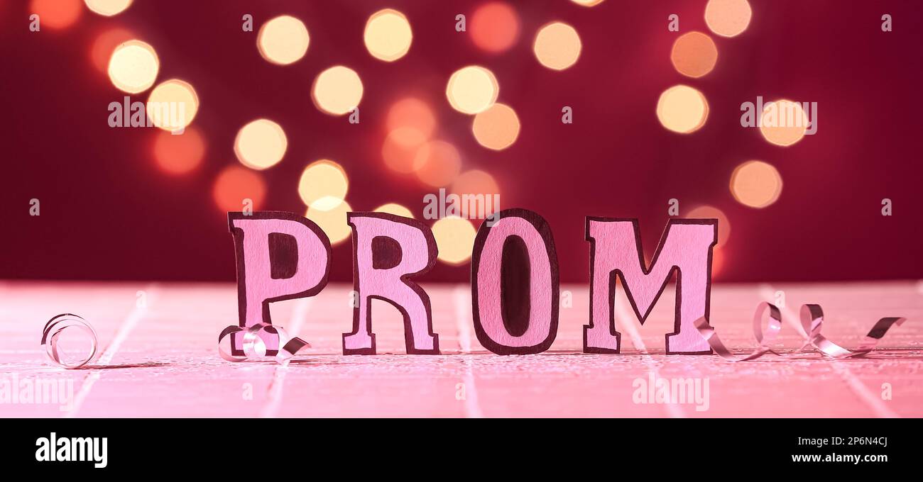 Paper word PROM on table against blurred lights Stock Photo - Alamy