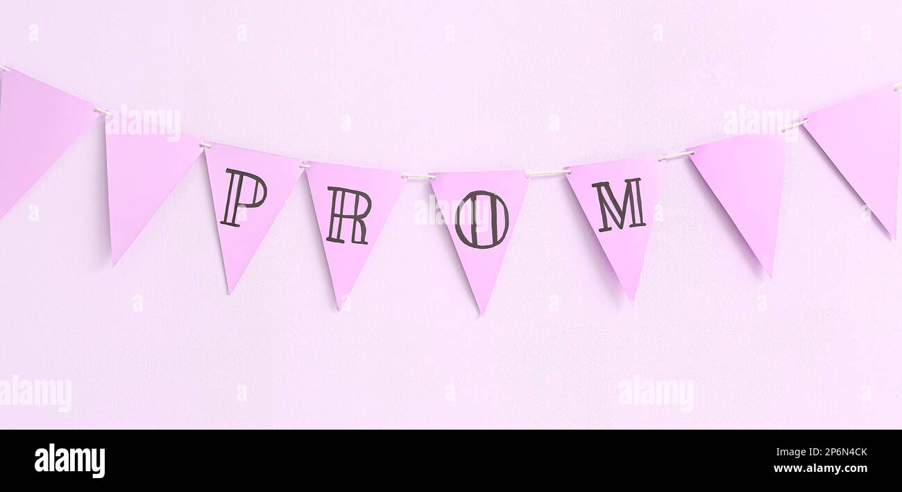 Paper bunting flags with word PROM on light lilac background Stock ...