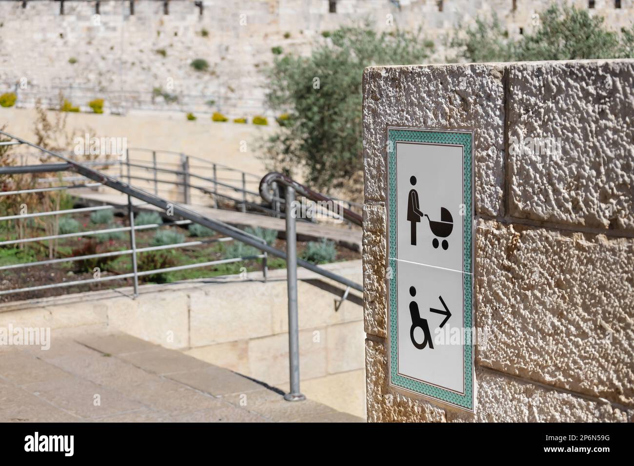 Direction sign for wheelchair and pram access in park, closeup Stock Photo - Alamy
