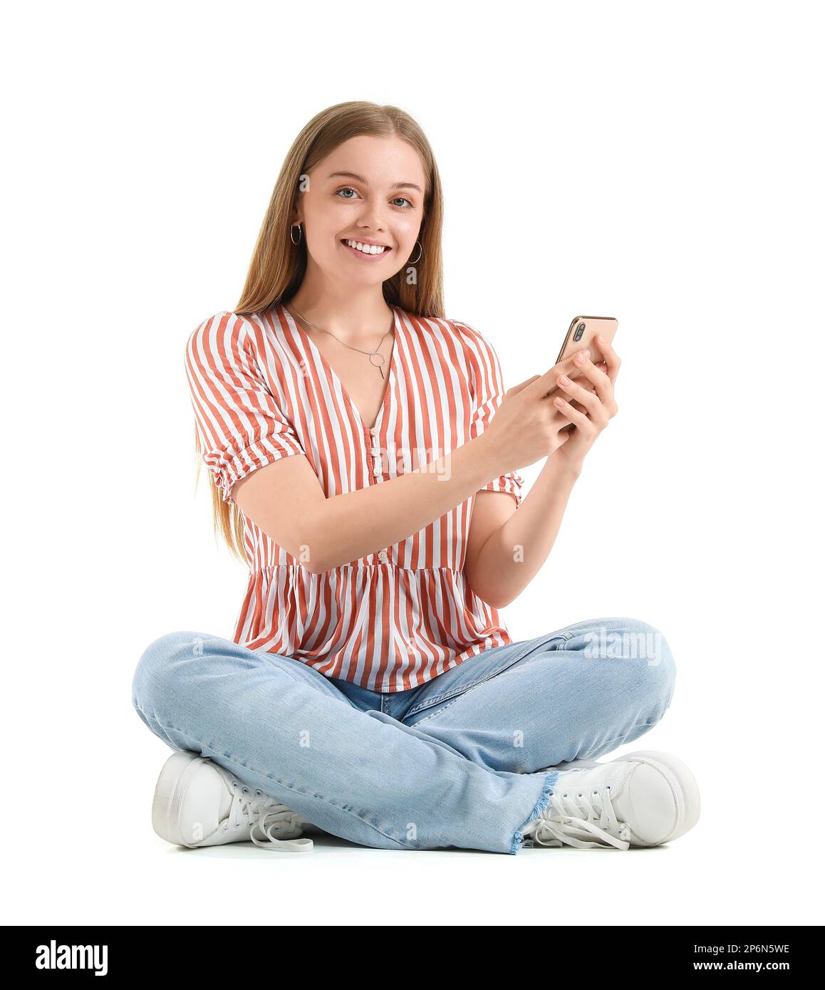 Beautiful girl using mobile phone on white background Stock Photo - Alamy