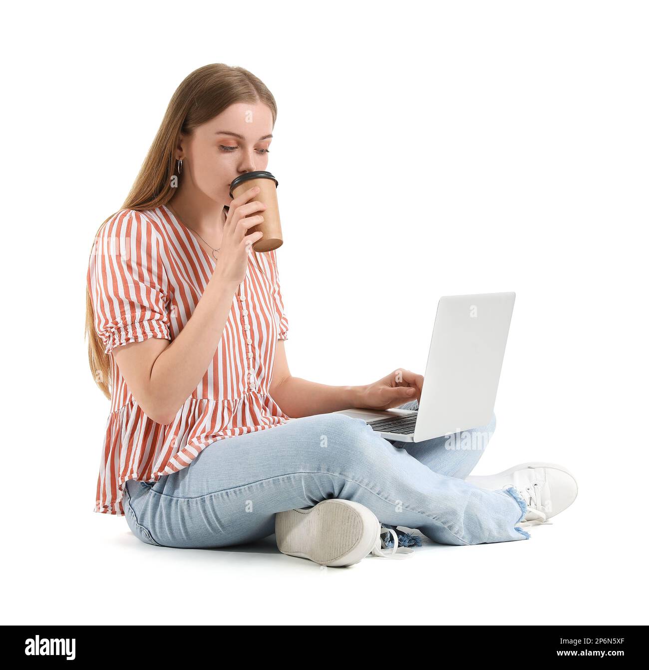 Beautiful girl with laptop drinking coffee on white background Stock ...