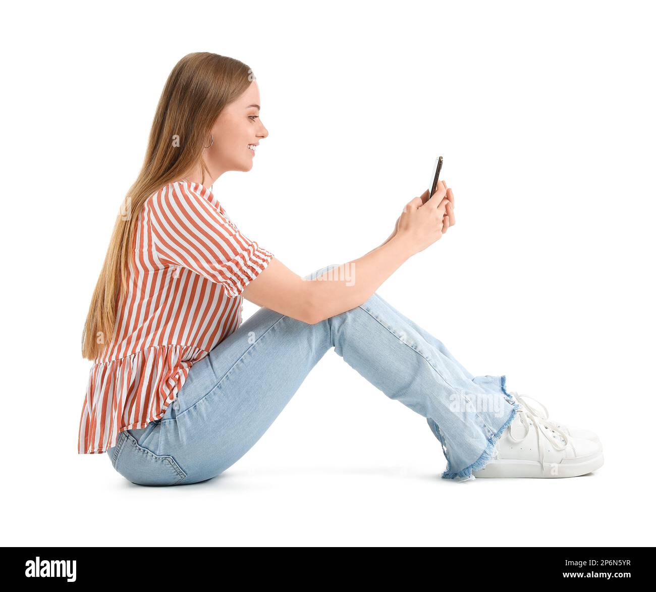 Beautiful girl using mobile phone on white background Stock Photo - Alamy
