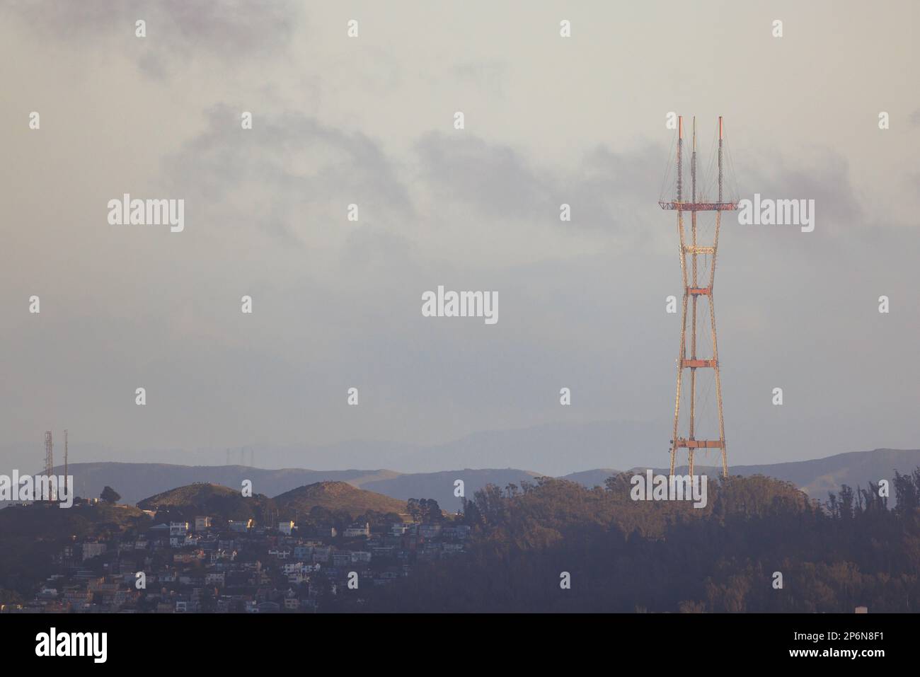 Sutro Tower over San Francisco hills and residential neighborhood on ...