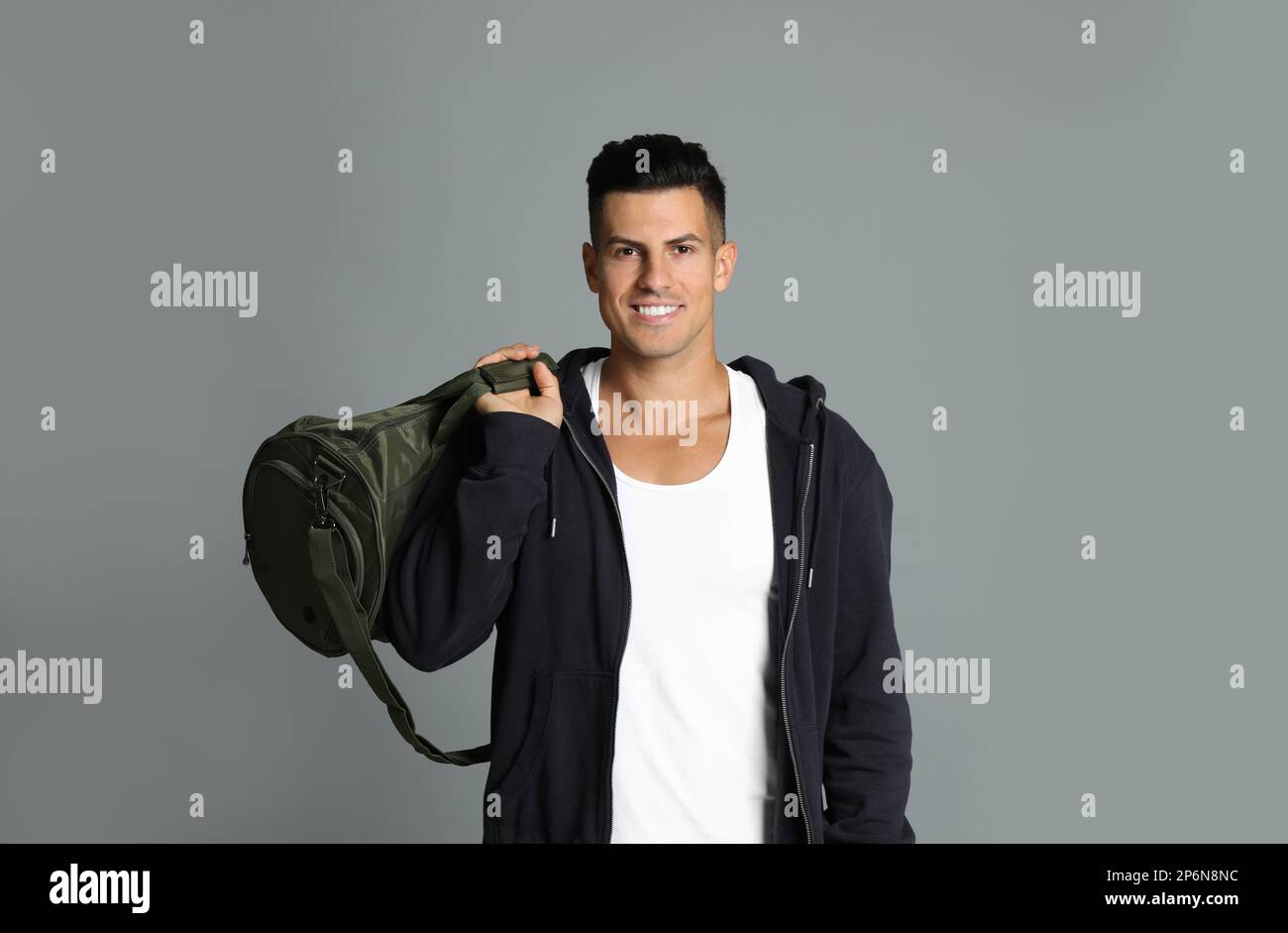 Man carrying gym bag hi-res stock photography and images - Alamy