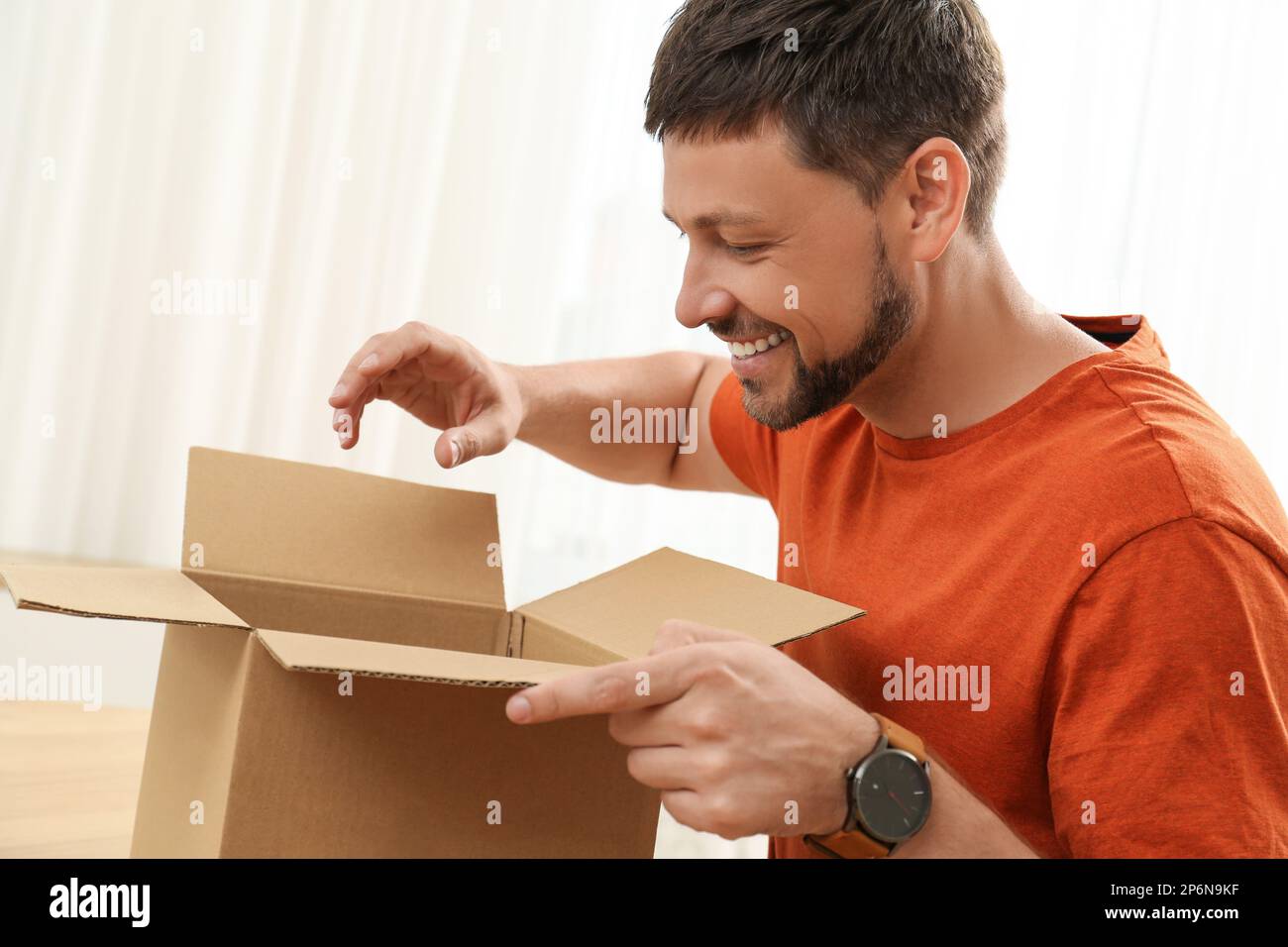Opening parcel hi-res stock photography and images - Alamy