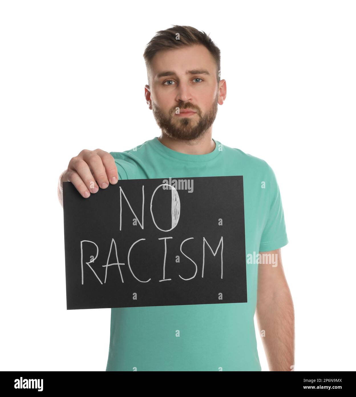 Young man holding sign with phrase No Racism on white background Stock ...