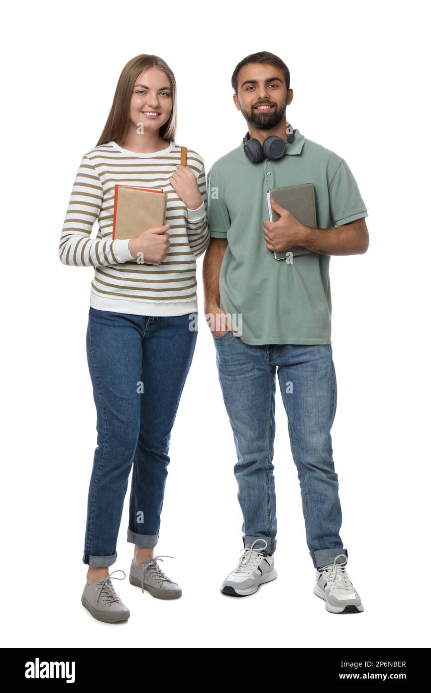 Happy students with books on white background Stock Photo - Alamy
