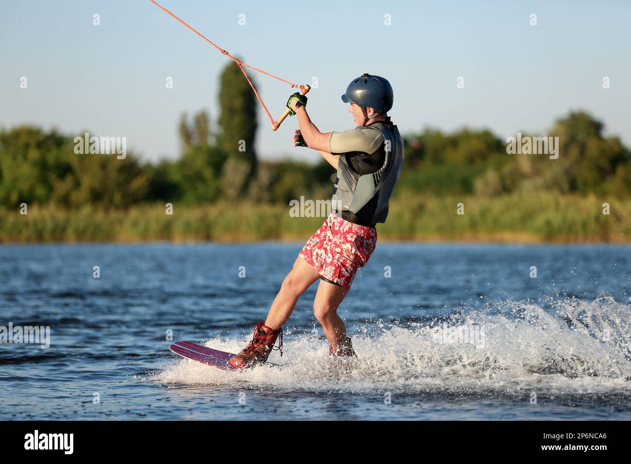 Teenage boy wakeboarding on river. Extreme water sport Stock Photo - Alamy