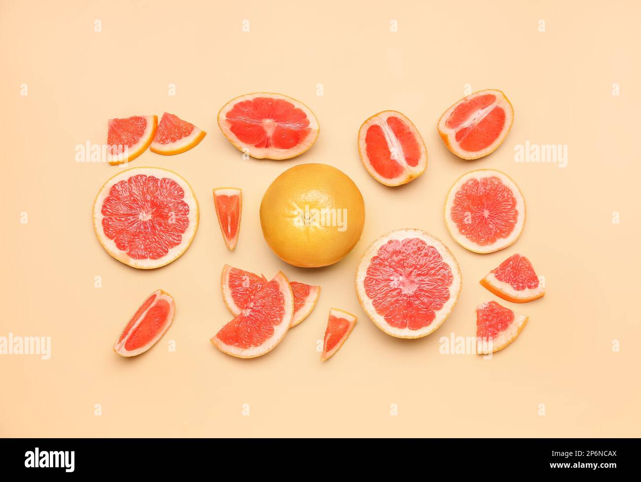 Composition with pieces of ripe grapefruit on color background Stock ...