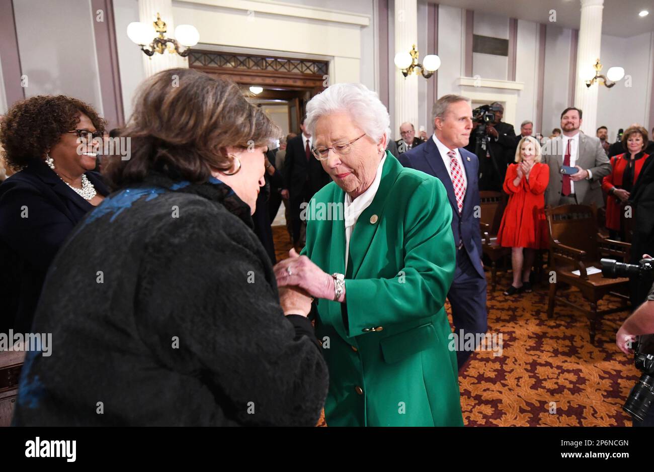 Alabama Gov. Kay Ivey greets Terry Saban, wife of University of Alabama ...