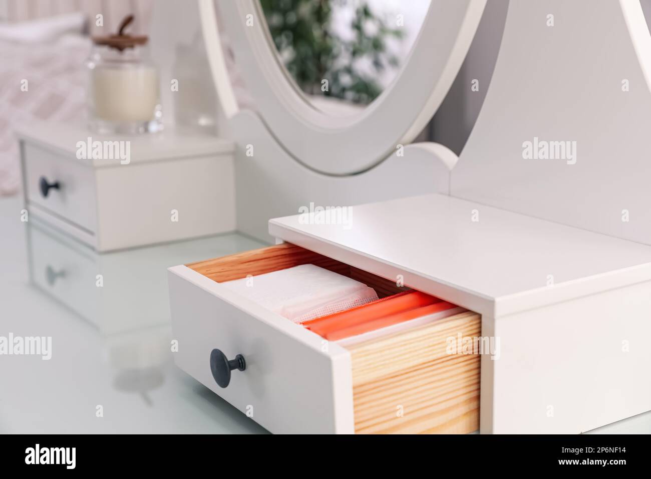 Different feminine hygiene products in drawer of dressing table indoors ...