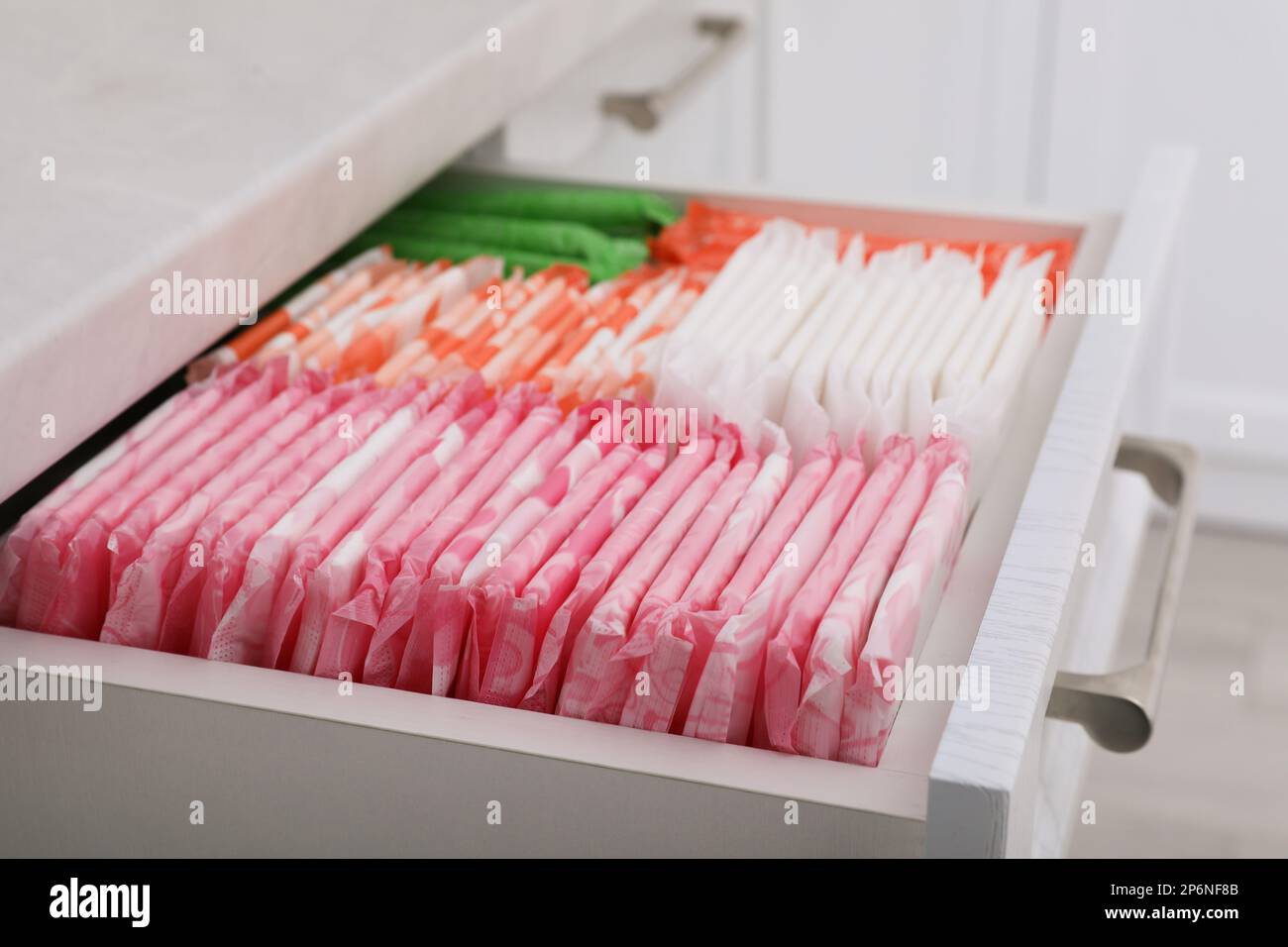 Storage of different feminine hygiene products in drawer indoors ...