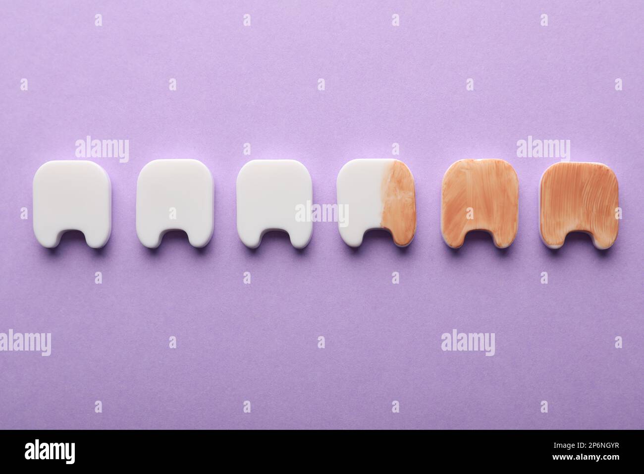 Clean and dirty plastic teeth on violet background, flat lay Stock ...
