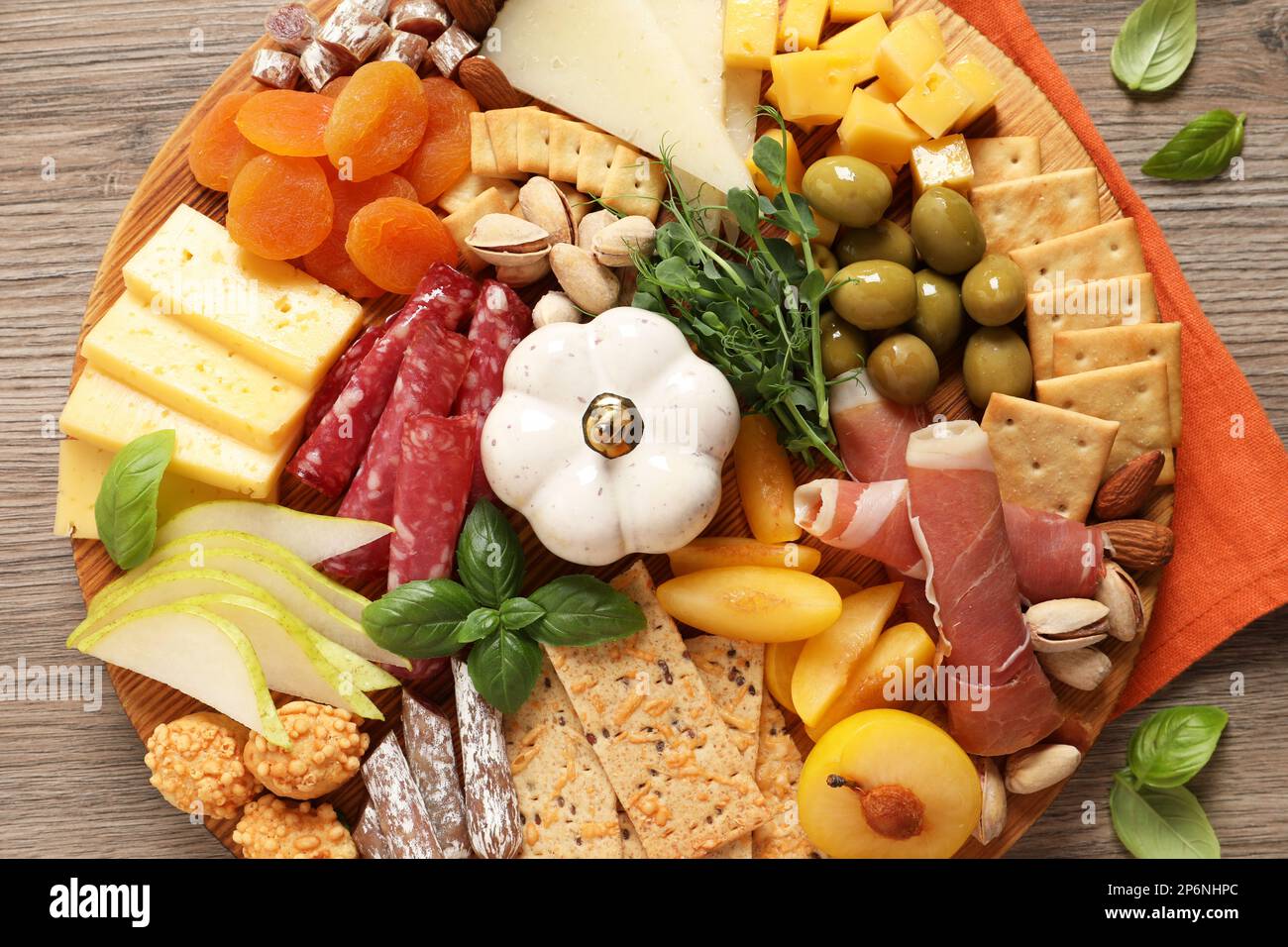 Different tasty appetizers on wooden table, top view Stock Photo - Alamy