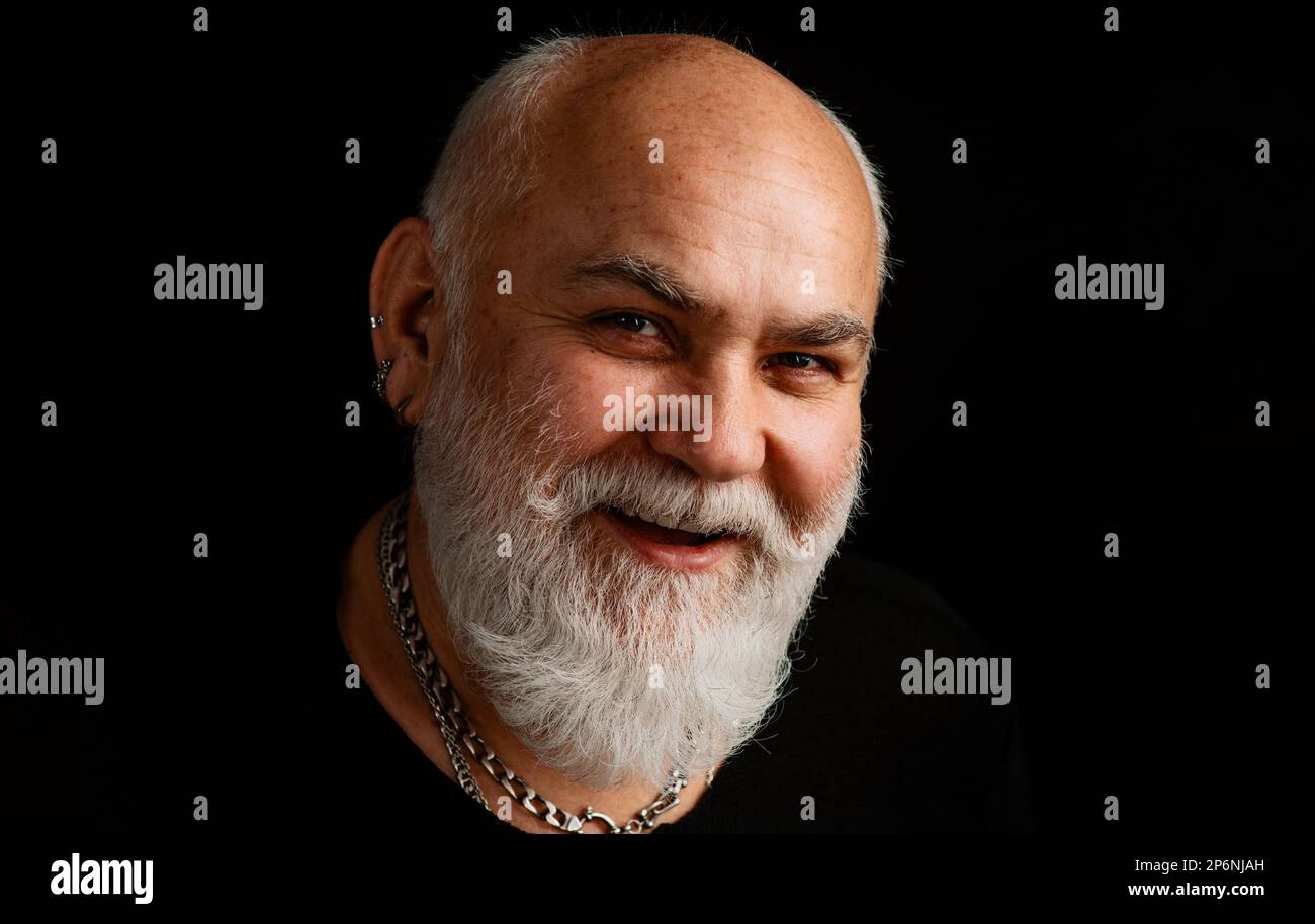 Happy retirement. Close up portrait of senior smiling pensioner looking at camera. Old Man ...
