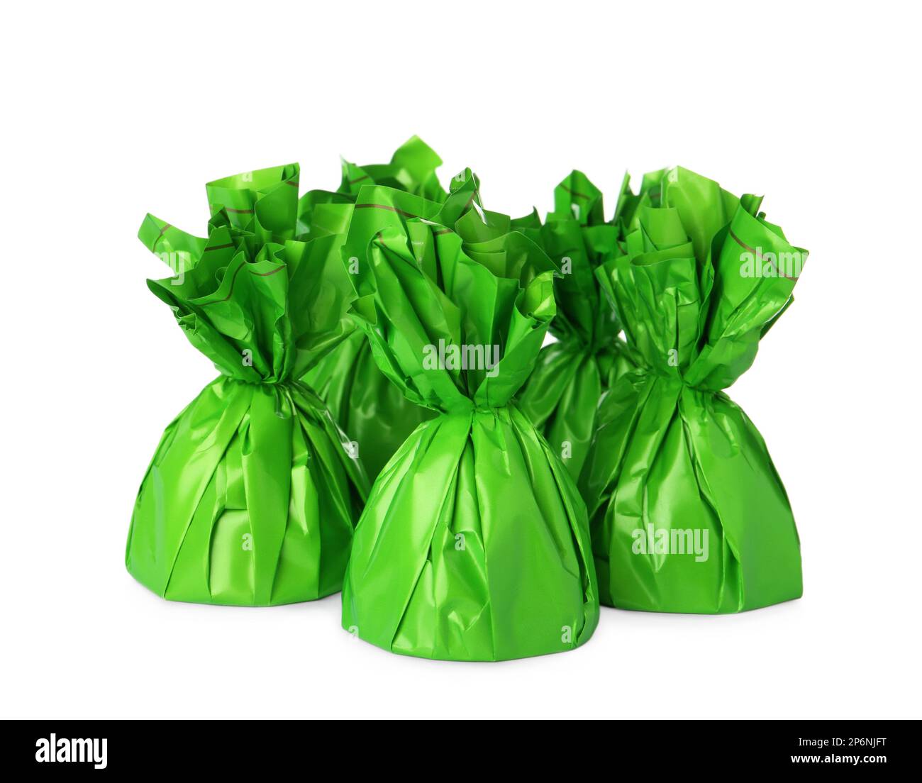 Delicious candies in green wrappers on white background Stock Photo - Alamy