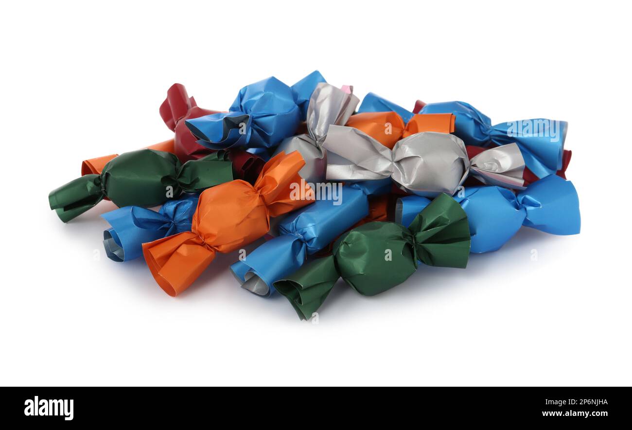 Many candies in colorful wrappers on white background Stock Photo - Alamy