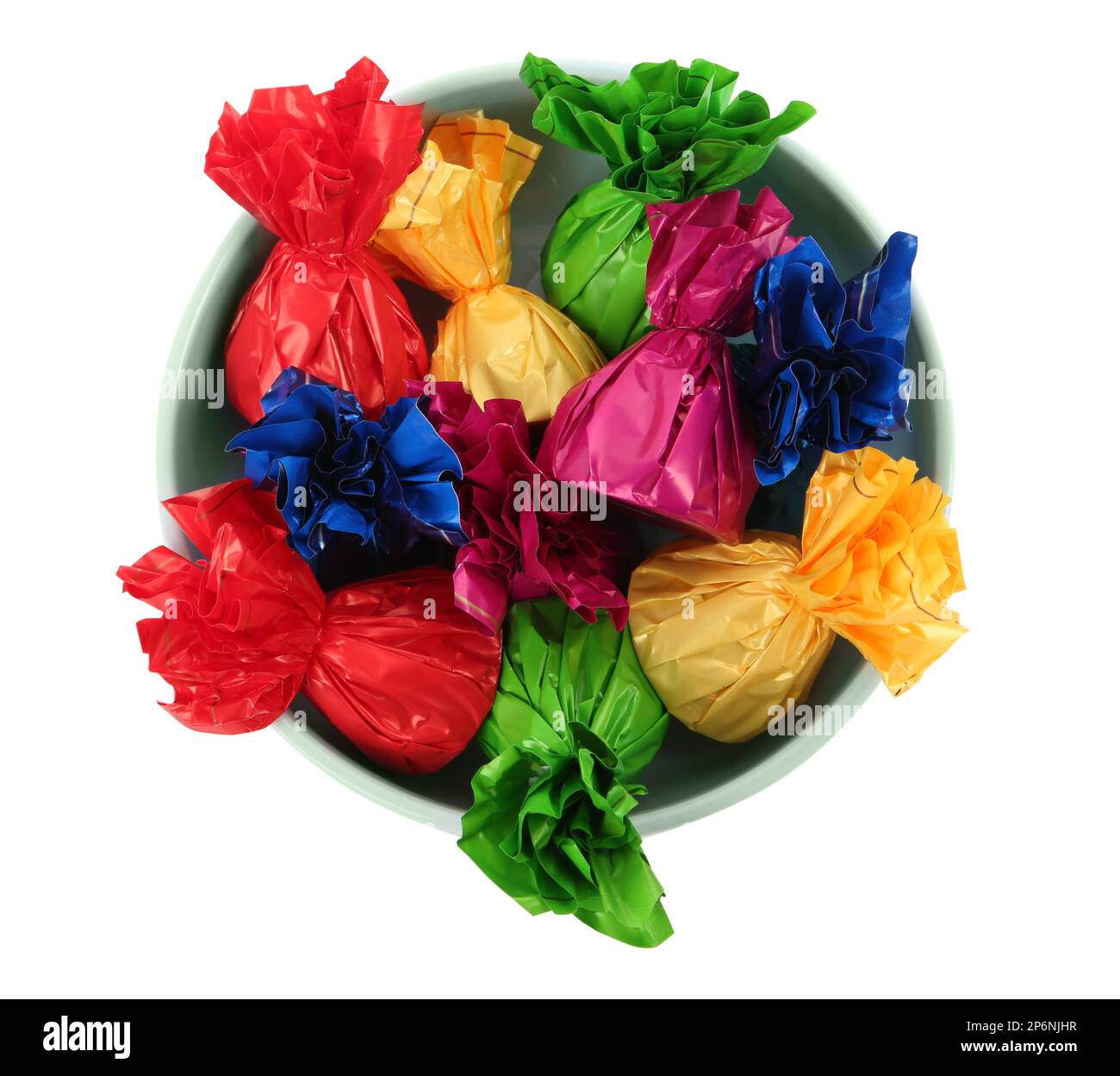 Bowl with candies in colorful wrappers isolated on white, top view ...
