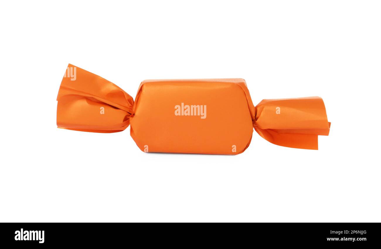 Delicious candy in orange wrapper isolated on white Stock Photo - Alamy