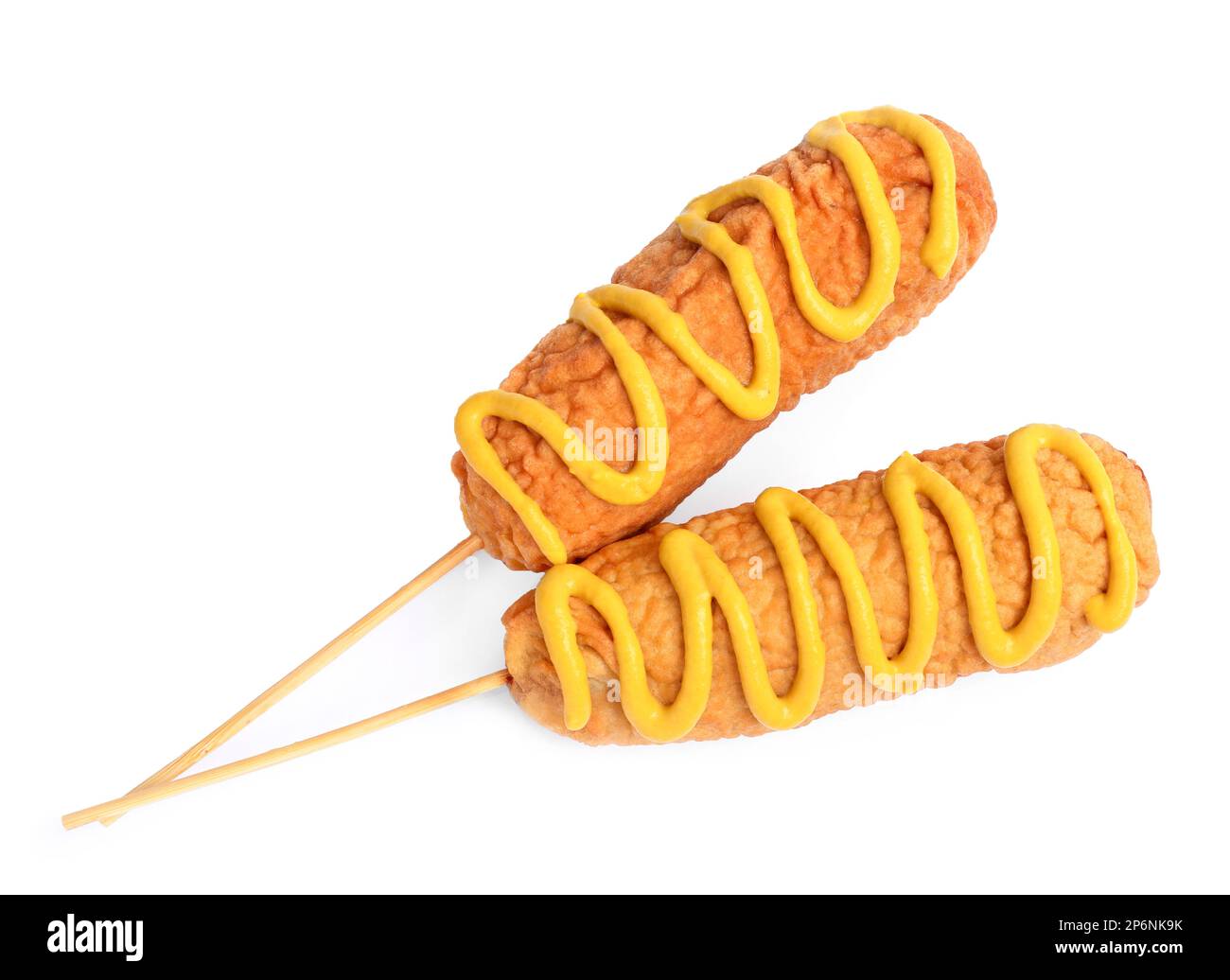 Delicious deep fried corn dogs with mustard on white background, top ...