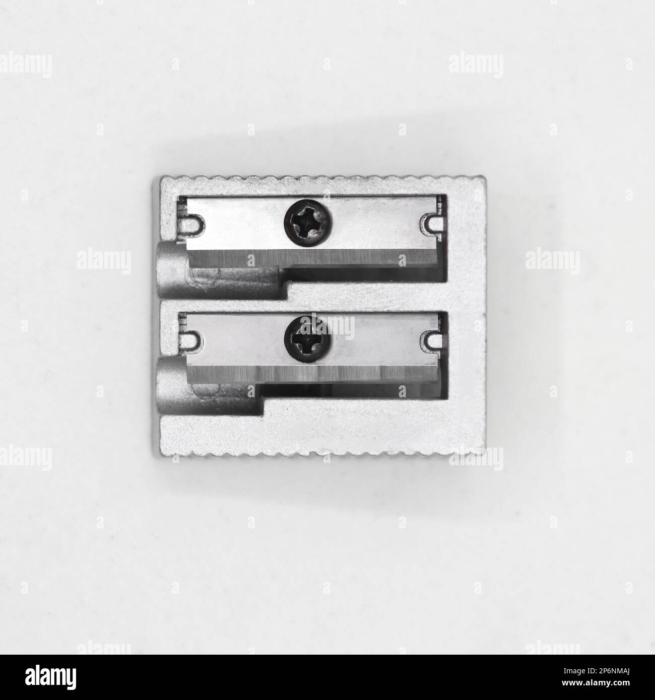 a clean twin pencil sharpener made of stainless steel isolated in a ...