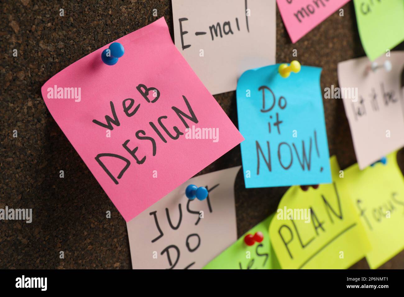 Colorful reminder notes pinned to cork board, closeup Stock Photo - Alamy