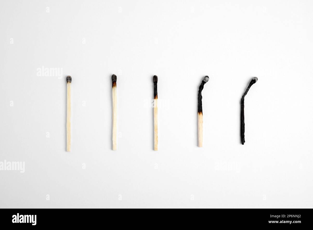 Different stages of burnt matches on white background, flat lay Stock ...