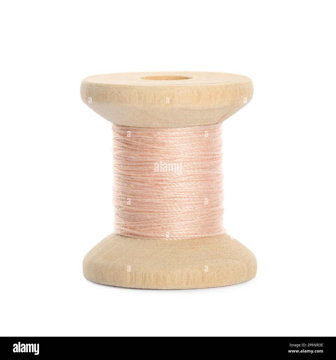 Wooden spool of pale pink sewing thread isolated on white Stock Photo ...