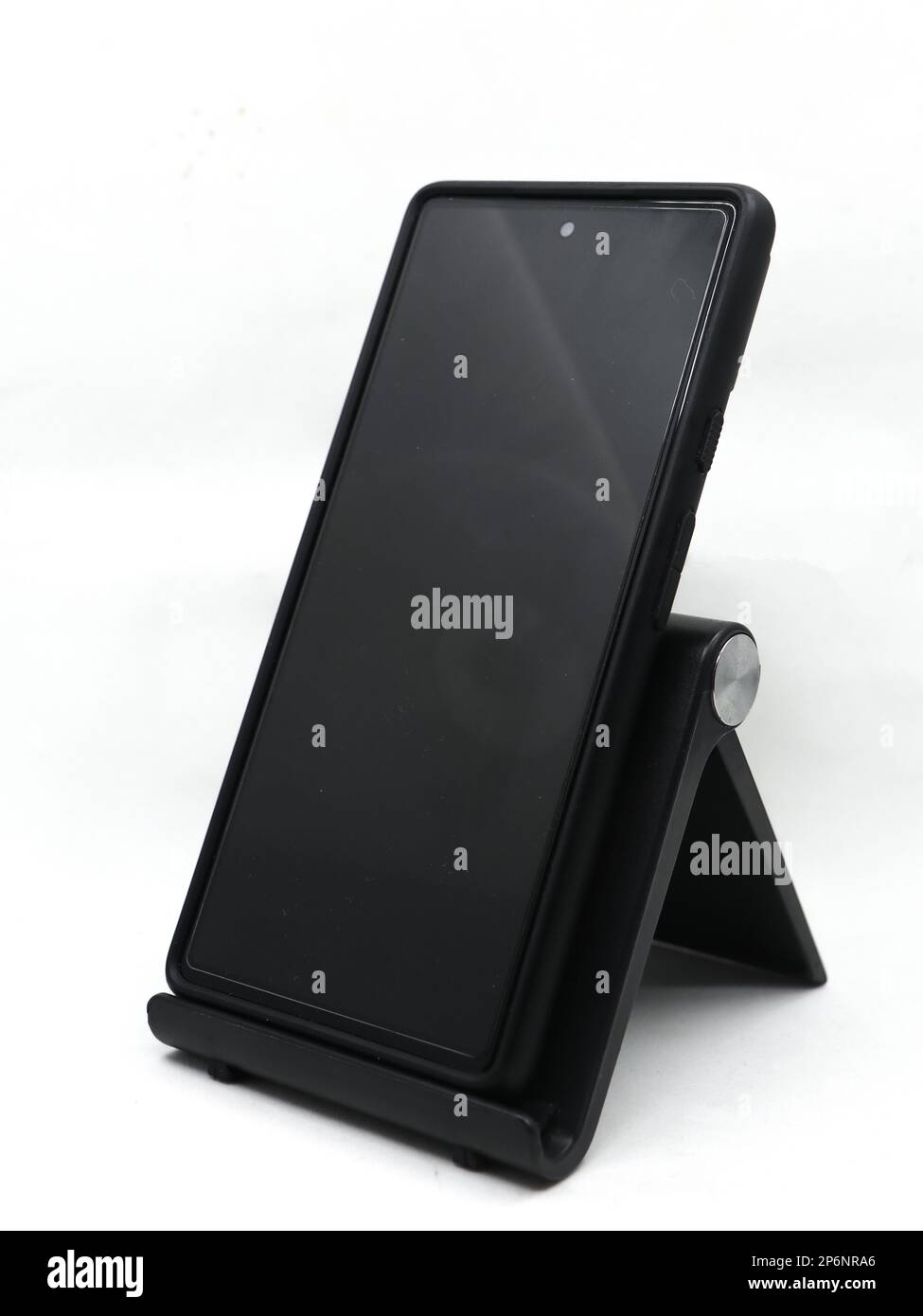 a smartphone placed on an adjustable mobile holder stand at an angle ... a smartphone placed on an adjustable mobile holder stand at an angle ...
