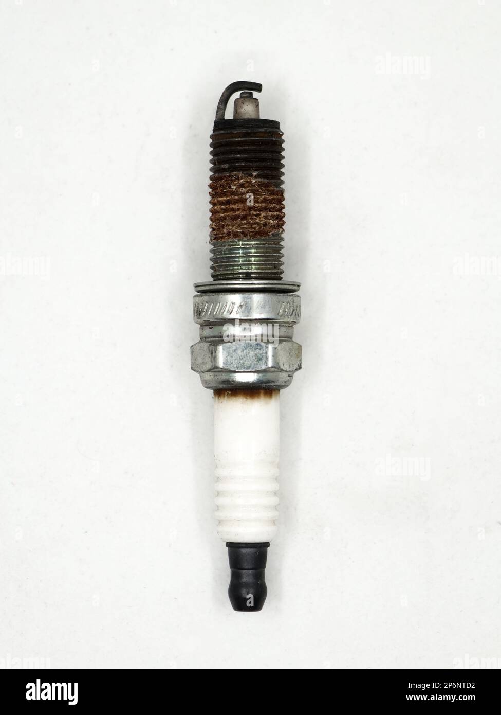 closeup of an old used rusty copper spark plug which is a component in ...