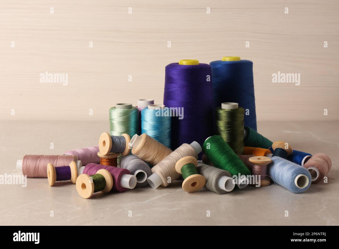 Set of color sewing threads on light grey table Stock Photo - Alamy
