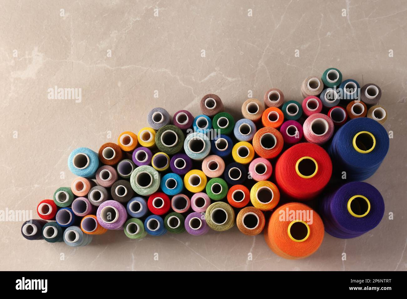 Set of color sewing threads on light grey table, flat lay Stock Photo ...